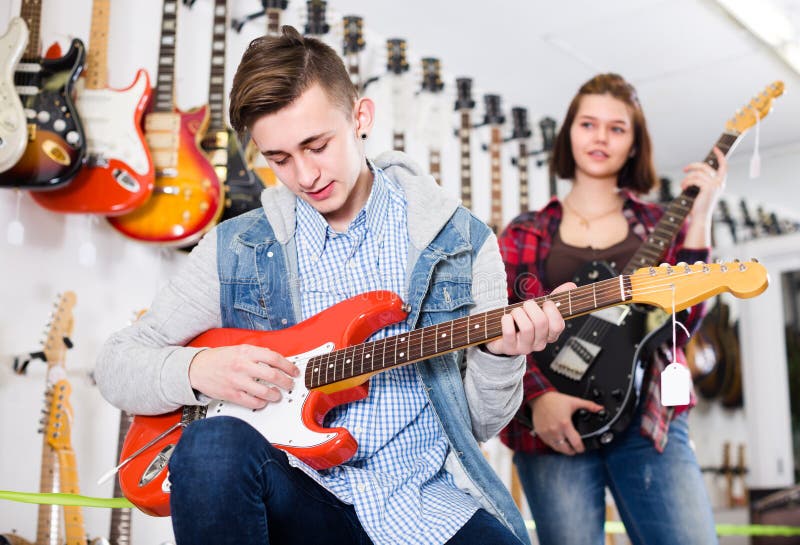 Young Musicians are Deciding on Suitable Amp Stock Photo - Image of ...