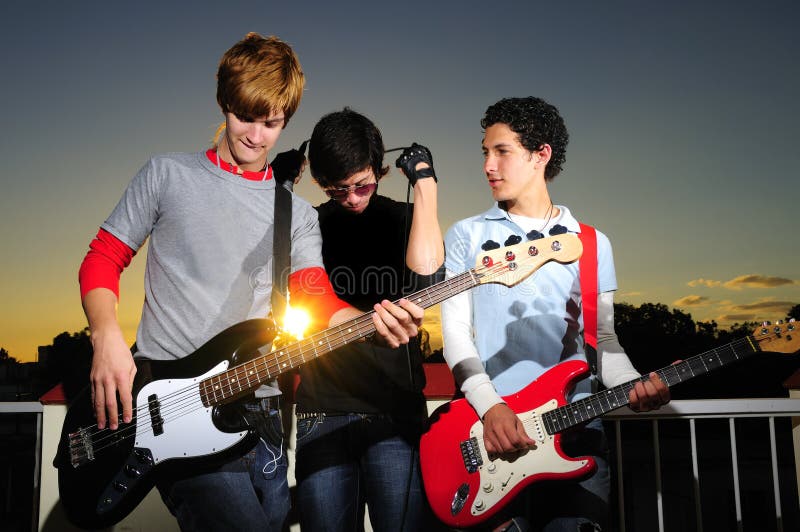 Young Musicians Posing with Instruments Stock Image - Image of looking ...