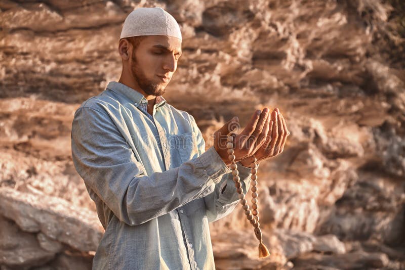 Young Muslim Man Praying Outdoors Stock Photo - Image of east, arabic ...