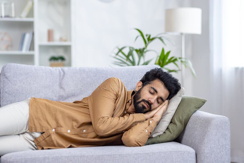 Young Muslim Man is Sleeping and Resting on Sofa at Home Stock Image ...