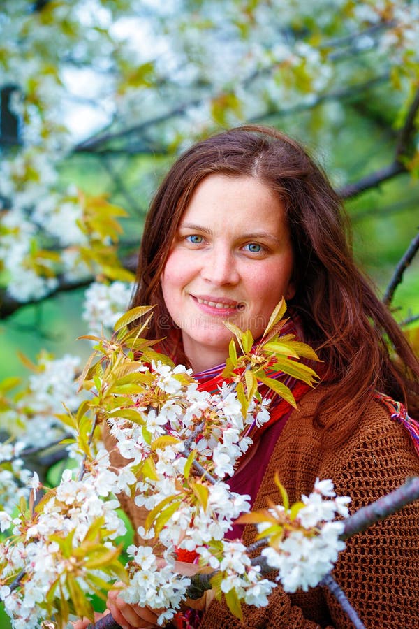 Young Natural Girl with Cherry Blossom in Spring Scenery. Stock Photo ...