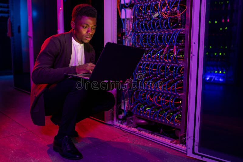 Young Network Engineer Examining Work of Supercomputer Stock Photo ...
