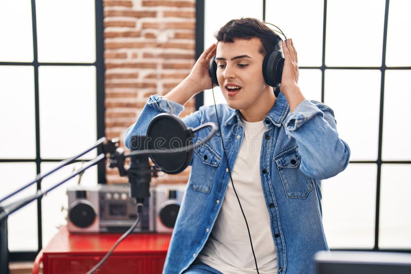 Young Non Binary Man Artist Singing Song at Music Studio Stock Photo ...