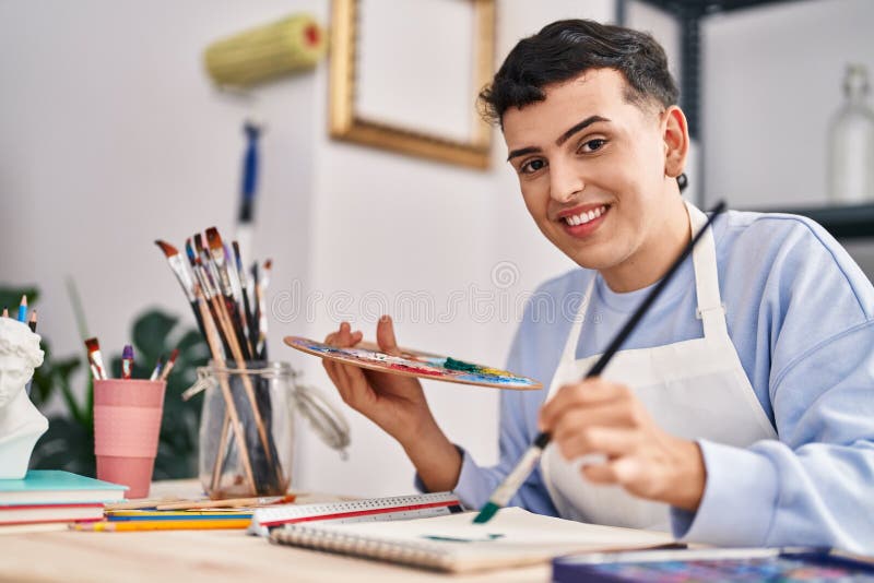 Young Non Binary Man Artist Smiling Confident Drawing on Notebook at ...