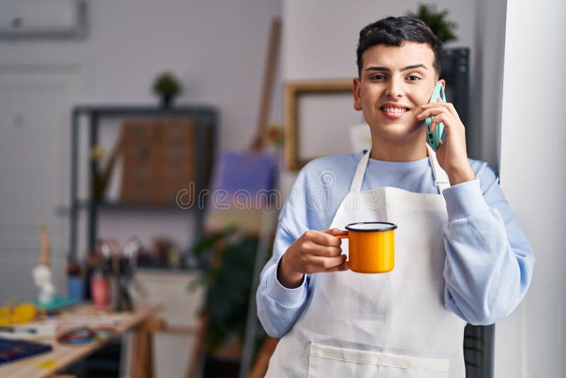 Young Non Binary Man Artist Talking on the Smartphone Drinking Coffee ...