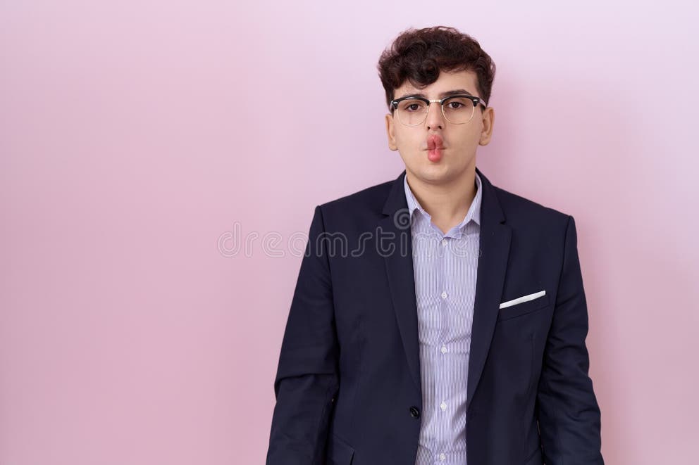 Young Non Binary Man with Beard Wearing Suit and Tie Making Fish Face ...