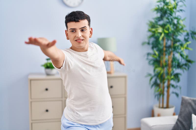 Young Non Binary Man Doing Yoga Exercise Sitting on Floor at Home Stock ...
