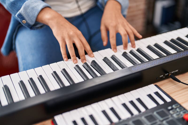 Young Non Binary Man Musician Playing Piano Keyboard at Music Studio ...