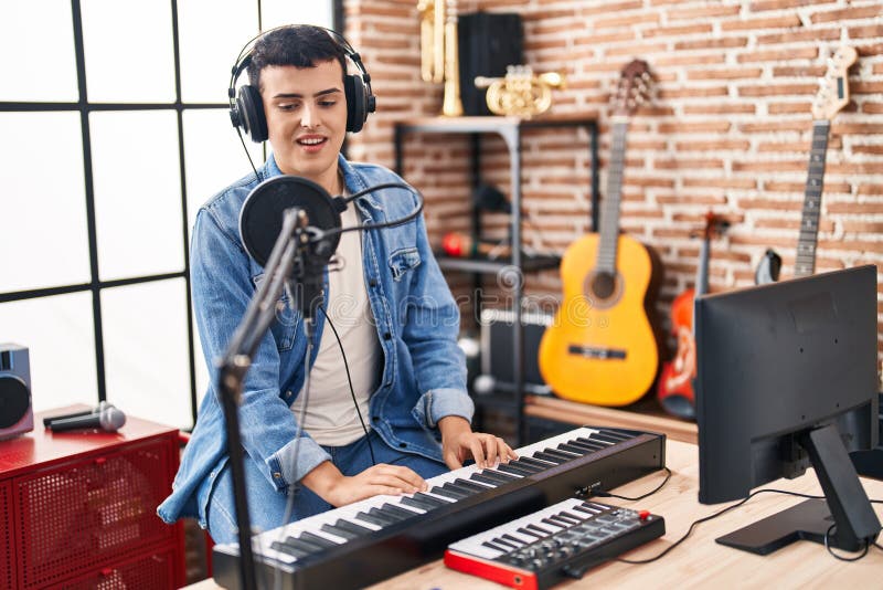 Young Non Binary Man Musician Singing Song Playing Piano Keyboard at ...