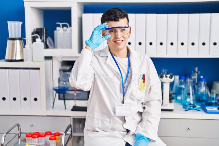 Young Non Binary Man Scientist Smiling Confident at Laboratory Stock ...