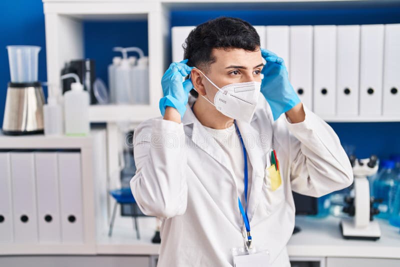 Young Non Binary Man Scientist Wearing Medical Mask at Laboratory Stock ...