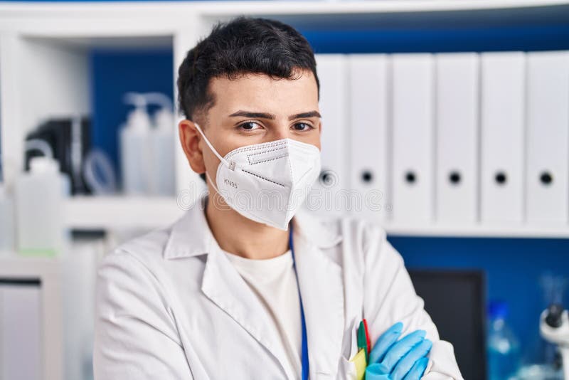 Young Non Binary Man Scientist Wearing Medical Mask at Laboratory Stock ...