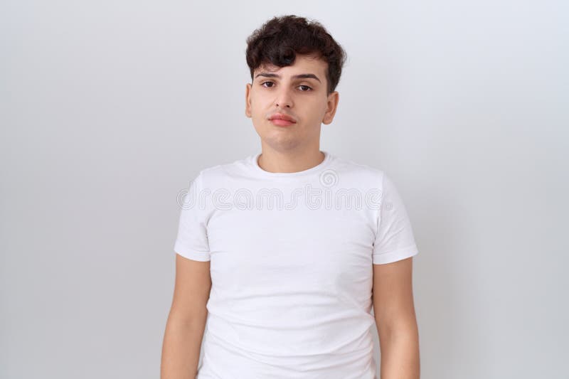 Young Non Binary Man Wearing Casual White T Shirt Relaxed with Serious ...