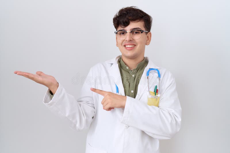 Young Non Binary Man Wearing Doctor Uniform and Stethoscope Amazed and ...