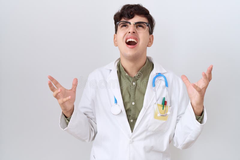 Young Non Binary Man Wearing Doctor Uniform and Stethoscope Crazy and ...