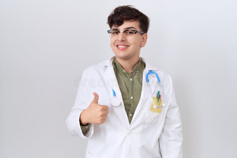 Young Non Binary Man Wearing Doctor Uniform and Stethoscope Doing Happy ...