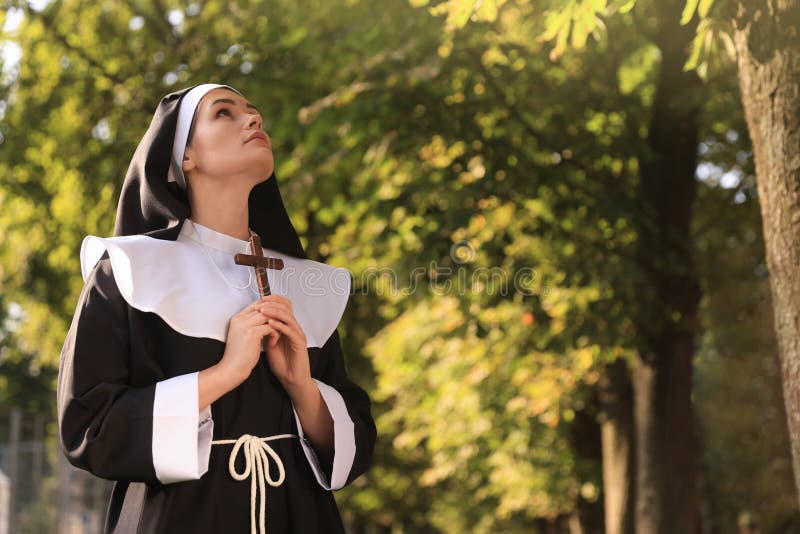 Young Nun with Christian Cross in Park Outdoors, Closeup Stock Photo ...