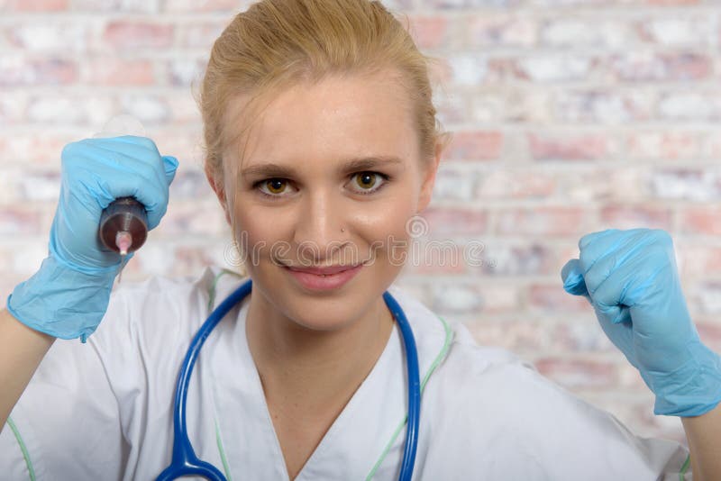 Menacing Nurse Holding Needle Stock Photo - Image of immunization ...