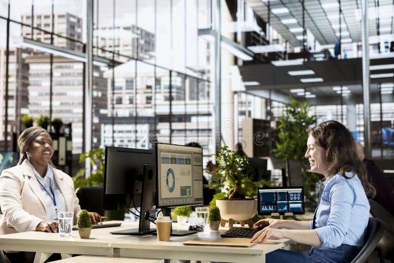 Young Office Employee Overseeing Business Operations at Workstation ...