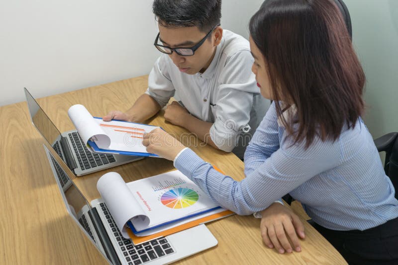 Office Employees Reading Financial Document Report in the Office Stock ...