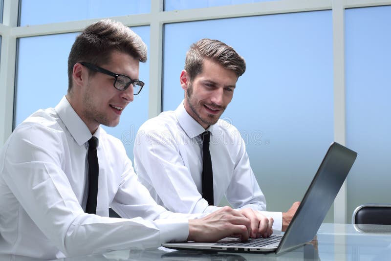 Young Office Worker Smiling, Colleagues Working in the Background ...
