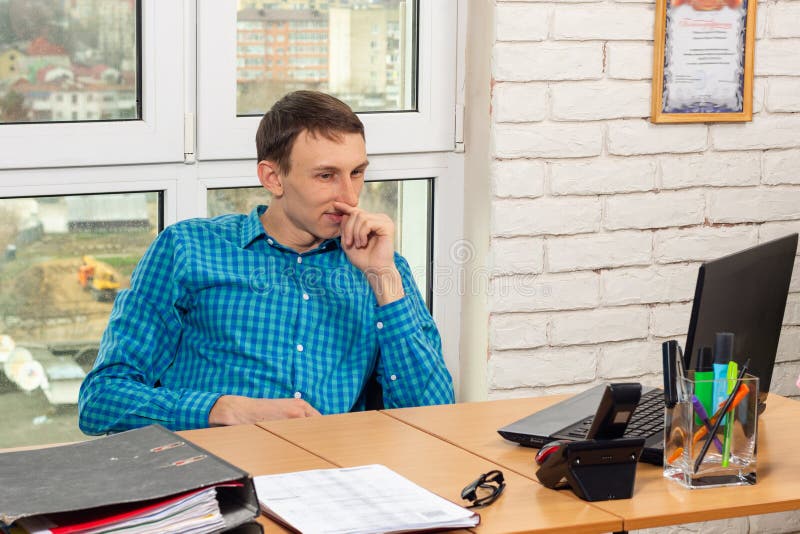 Young Office Worker Thinking in the Workplace Stock Photo - Image of ...