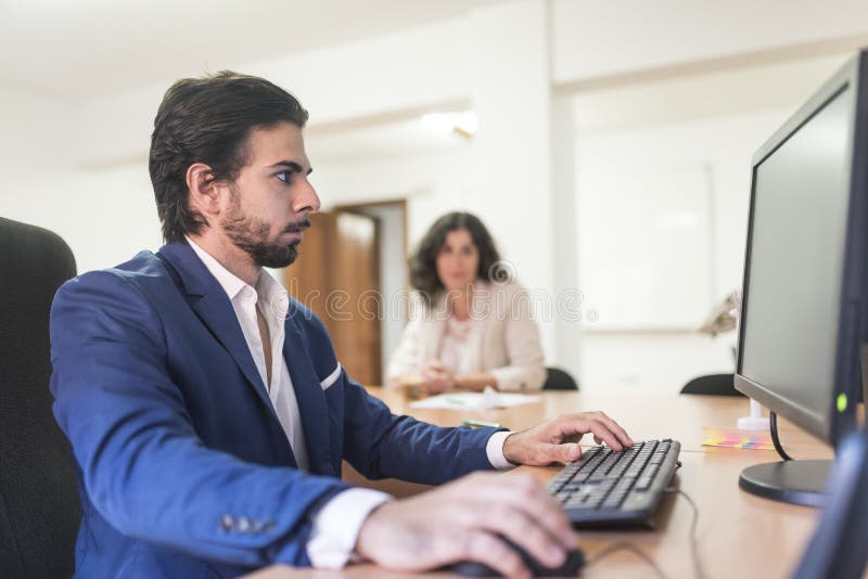 Young Office Worker Working at Computer in Desk Stock Image - Image of ...