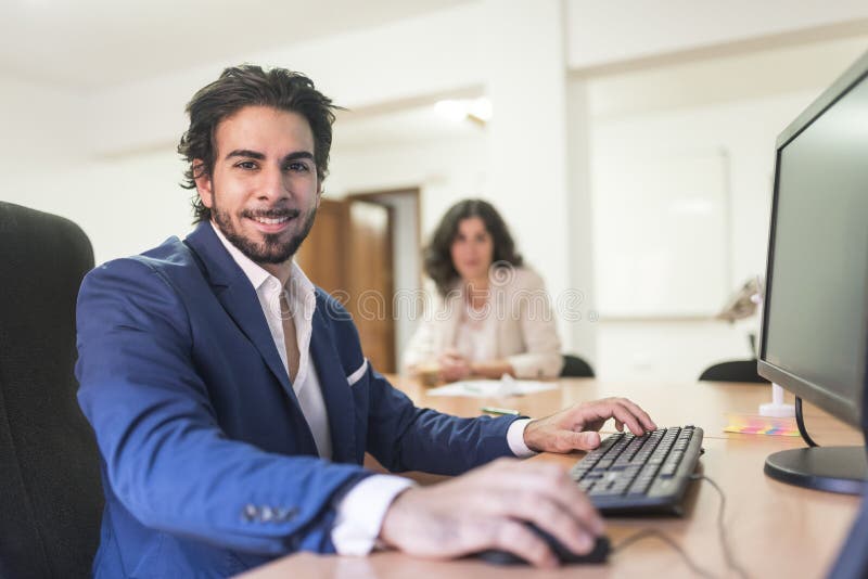 Young Office Worker Working at Computer in Desk Stock Image - Image of ...