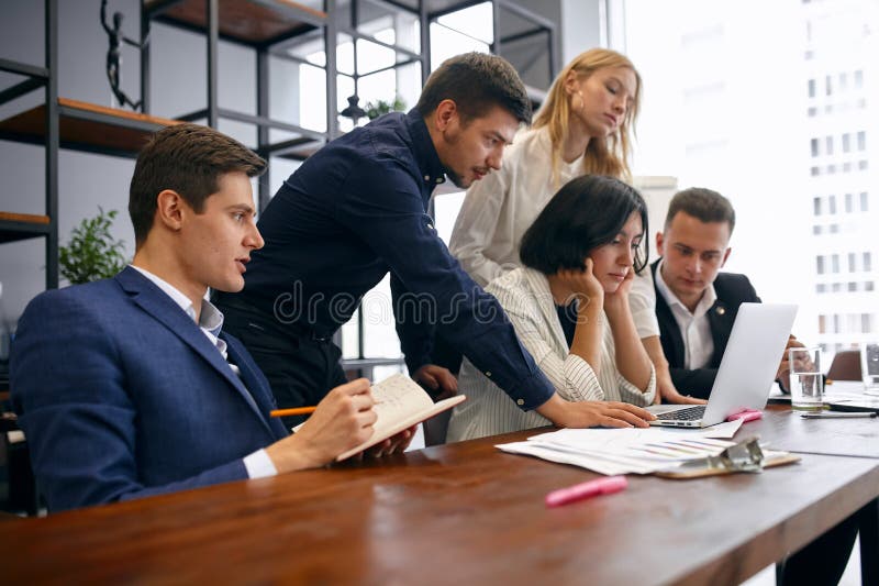 Young Office Workers Correcting The Document Stock Image - Image of ...