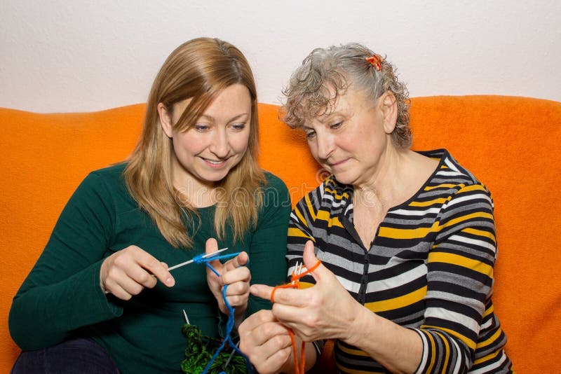 Two Women Knitting Together at Home Stock Image - Image of female ...