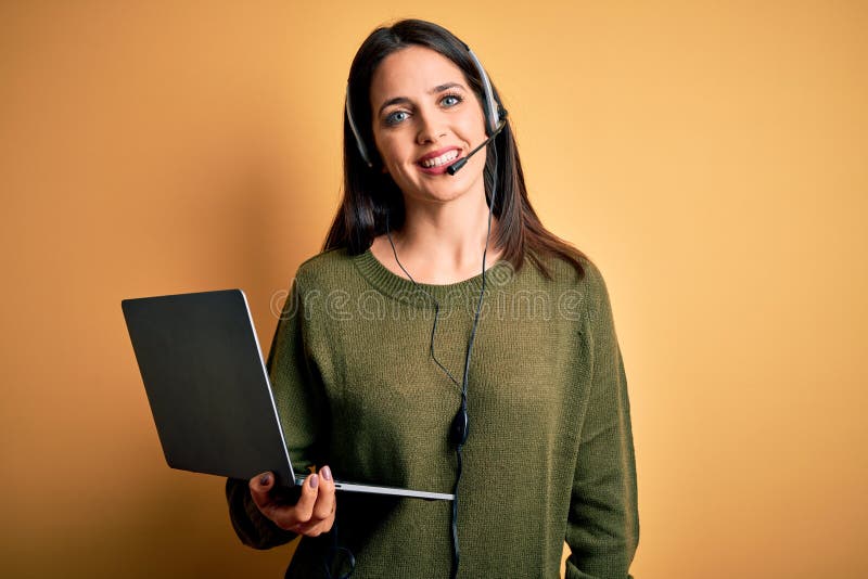 Young Operator Woman with Blue Eyes Working on Call Center Using ...
