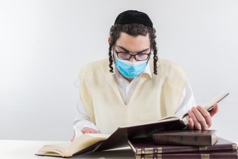 Young Orthodox with a Face Mask Studying Religious Texts - Concept of ...