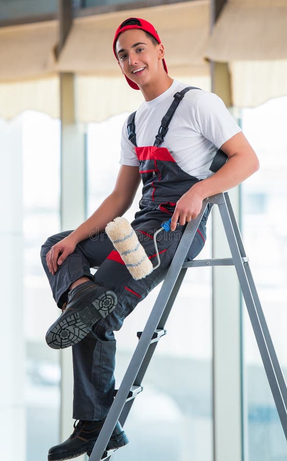 Young Painter Painting the Ceiling in Construction Concept Stock Photo ...