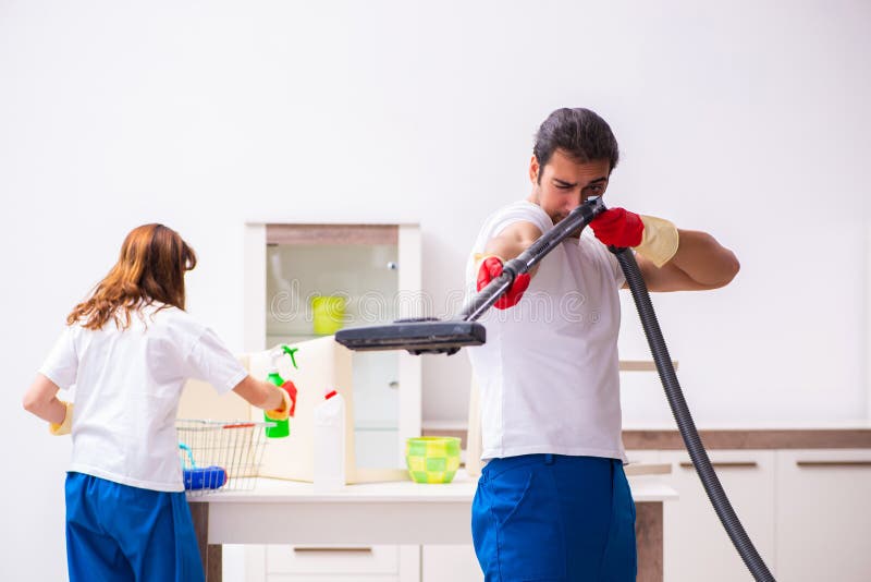 Young Pair Doing Housework at Home Stock Image - Image of domestic ...