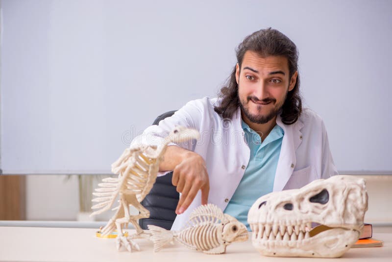 Young Male Paleontologist in Front of the Whiteboard Stock Photo ...