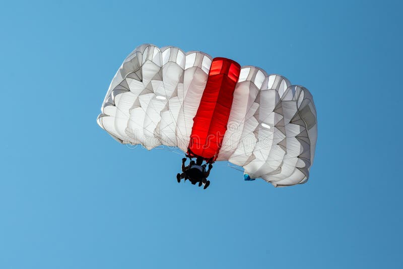 Parachute in the Sky. Skydiver is Flying a Parachute in the Blue Sky ...