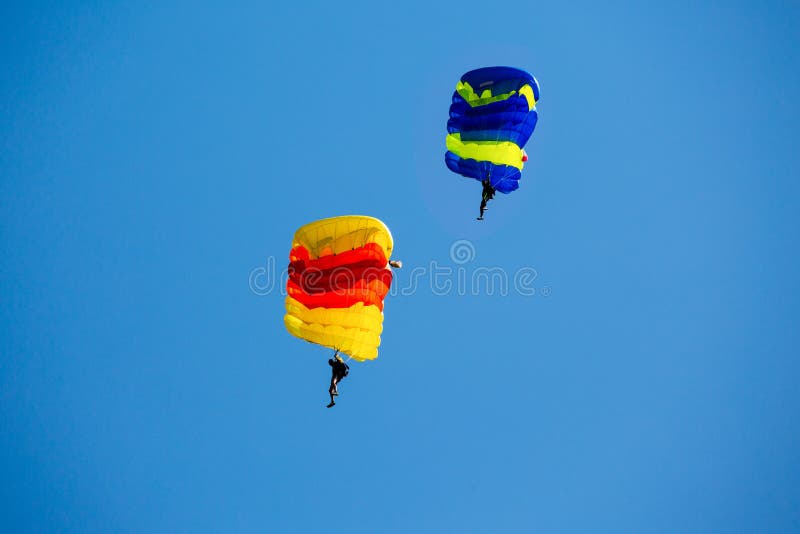 Parachute in the Sky. Skydiver is Flying a Parachute in the Blue Sky ...