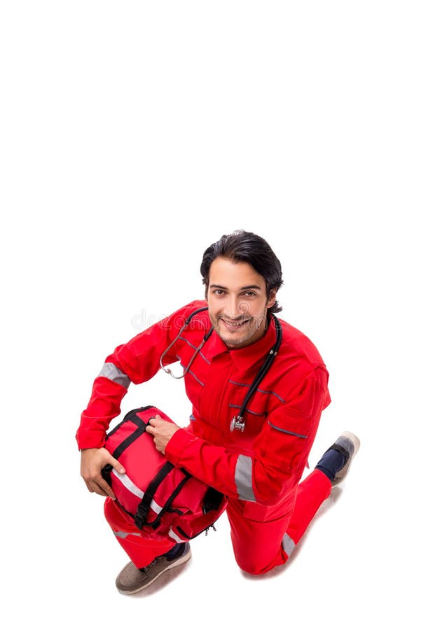 The Young Paramedic in Red Uniform Isolated on White Stock Photo ...