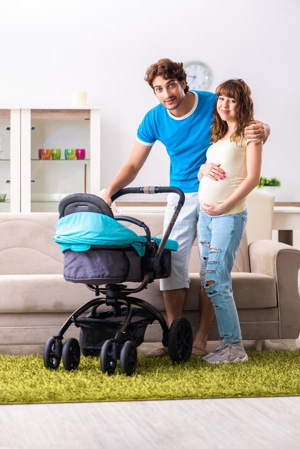 The Young Parents with Baby Expecting New Arrival Stock Photo - Image ...