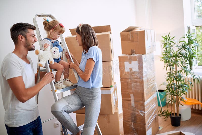 Parents with a Daughter Moving in New Home Stock Image - Image of ...