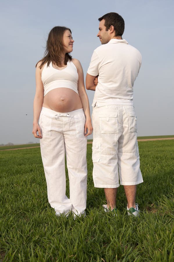 Young parents to be stock photo. Image of color, green - 24045942