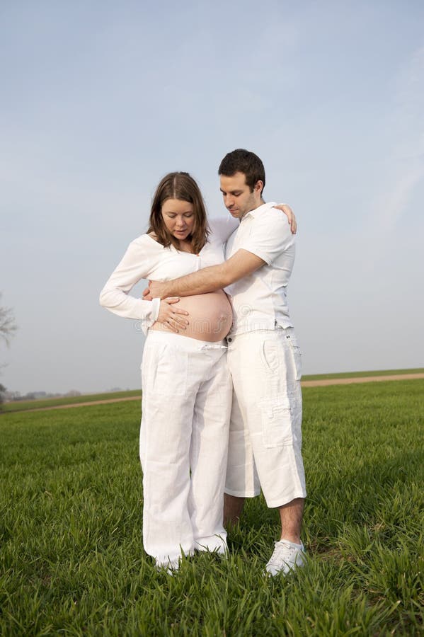 Young parents to be stock photo. Image of color, green - 24045942