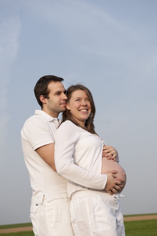 Young parents to be stock photo. Image of pregnancy, brown - 24046056