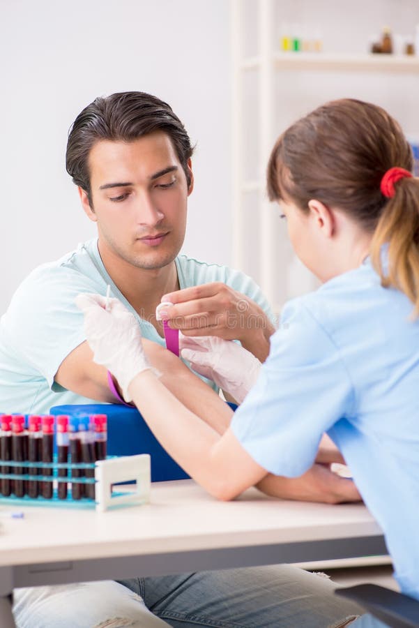 The Young Patient during Blood Test Sampling Procedure Stock Photo ...