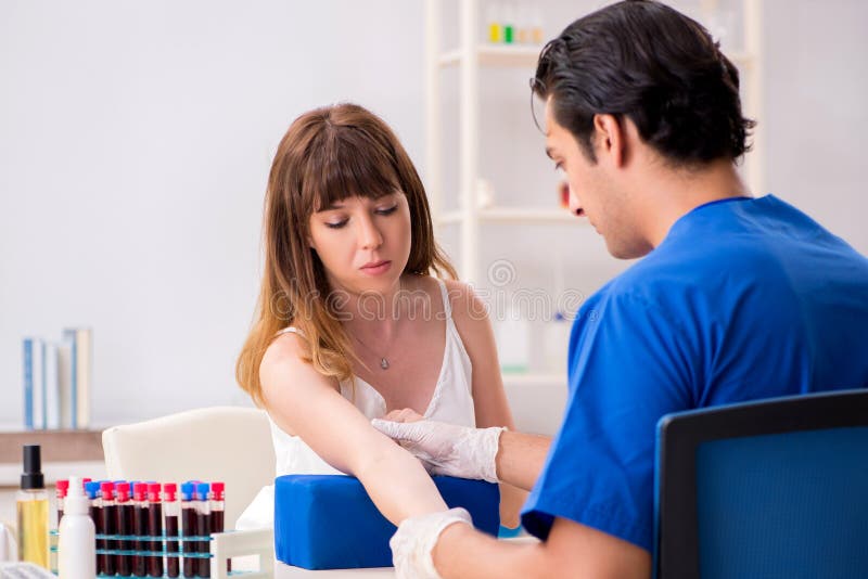 The Young Patient during Blood Test Sampling Procedure Stock Photo ...