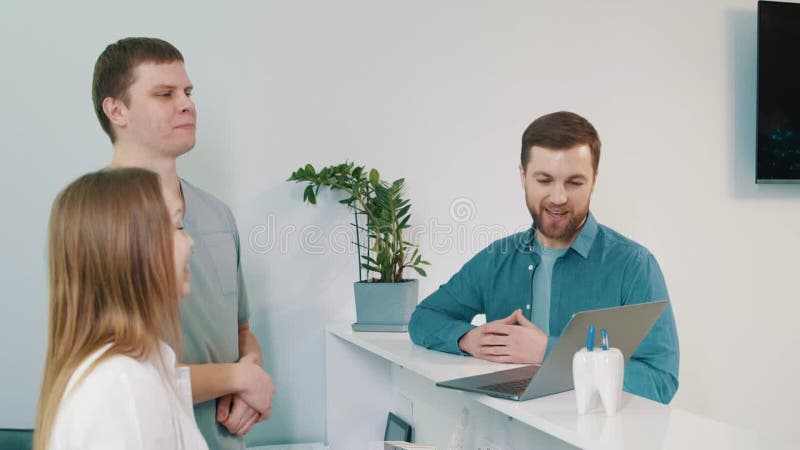 Young Patient Communicates with Doctors on the Reception Desk ...