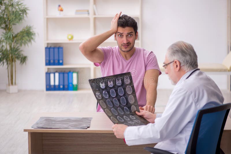 Young Male Patient Visiting Old Male Doctor Radiologist Stock Image ... Young Male Patient Visiting Old Male Doctor Radiologist Stock Image ...