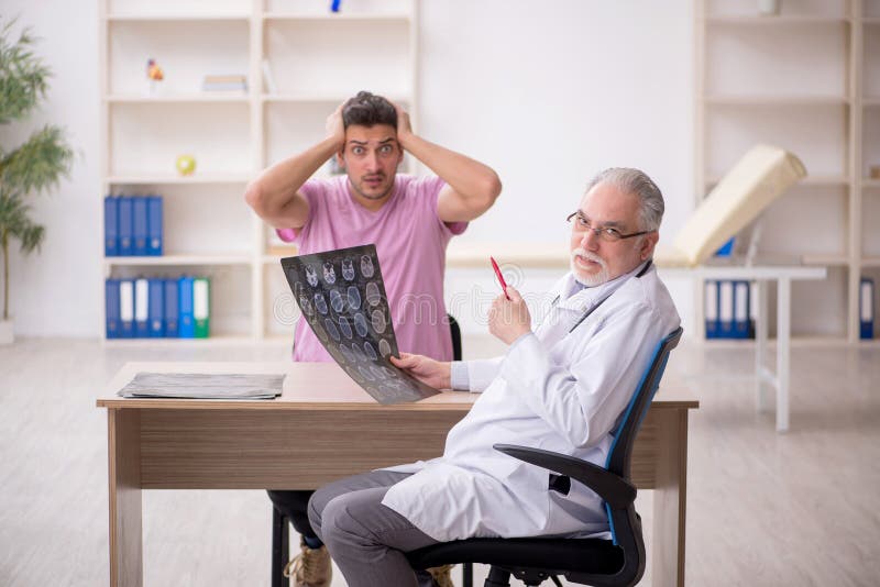 Young Male Patient Visiting Old Male Doctor Radiologist Stock Image ... Young Male Patient Visiting Old Male Doctor Radiologist Stock Image ...