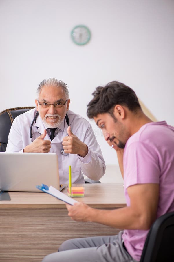 Young Male Patient Visiting Old Male Doctor Stock Photo - Image of ... Young Male Patient Visiting Old Male Doctor Stock Photo - Image of ...