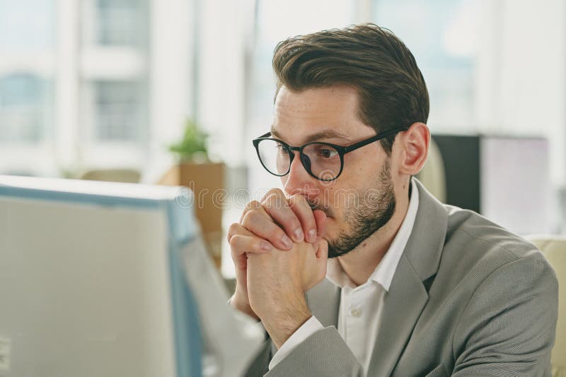 Young Pensive Businessman Cannot Understand Information on Computer ...